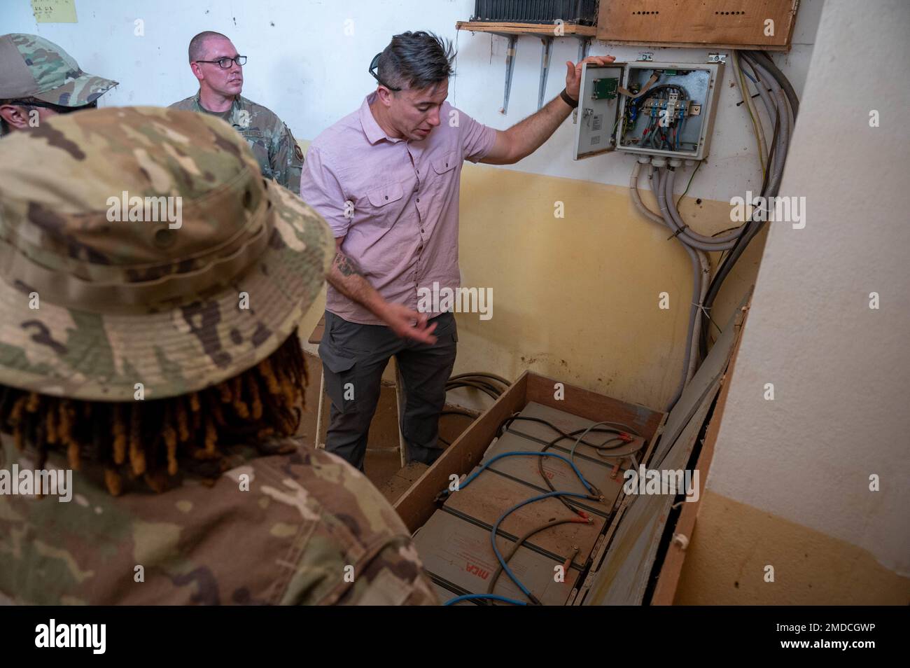 U.S. Army 351 Civil Affairs Soldier and U.S. Air Force Airmen inspect ...