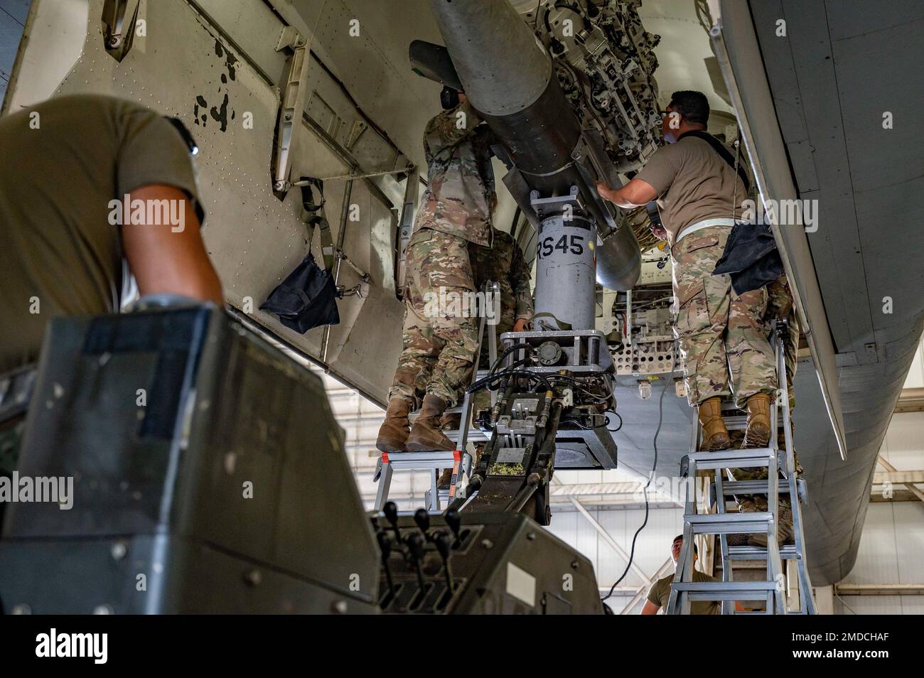 Weapons load crew members assigned to the 9th Aircraft Maintenance Unit ...