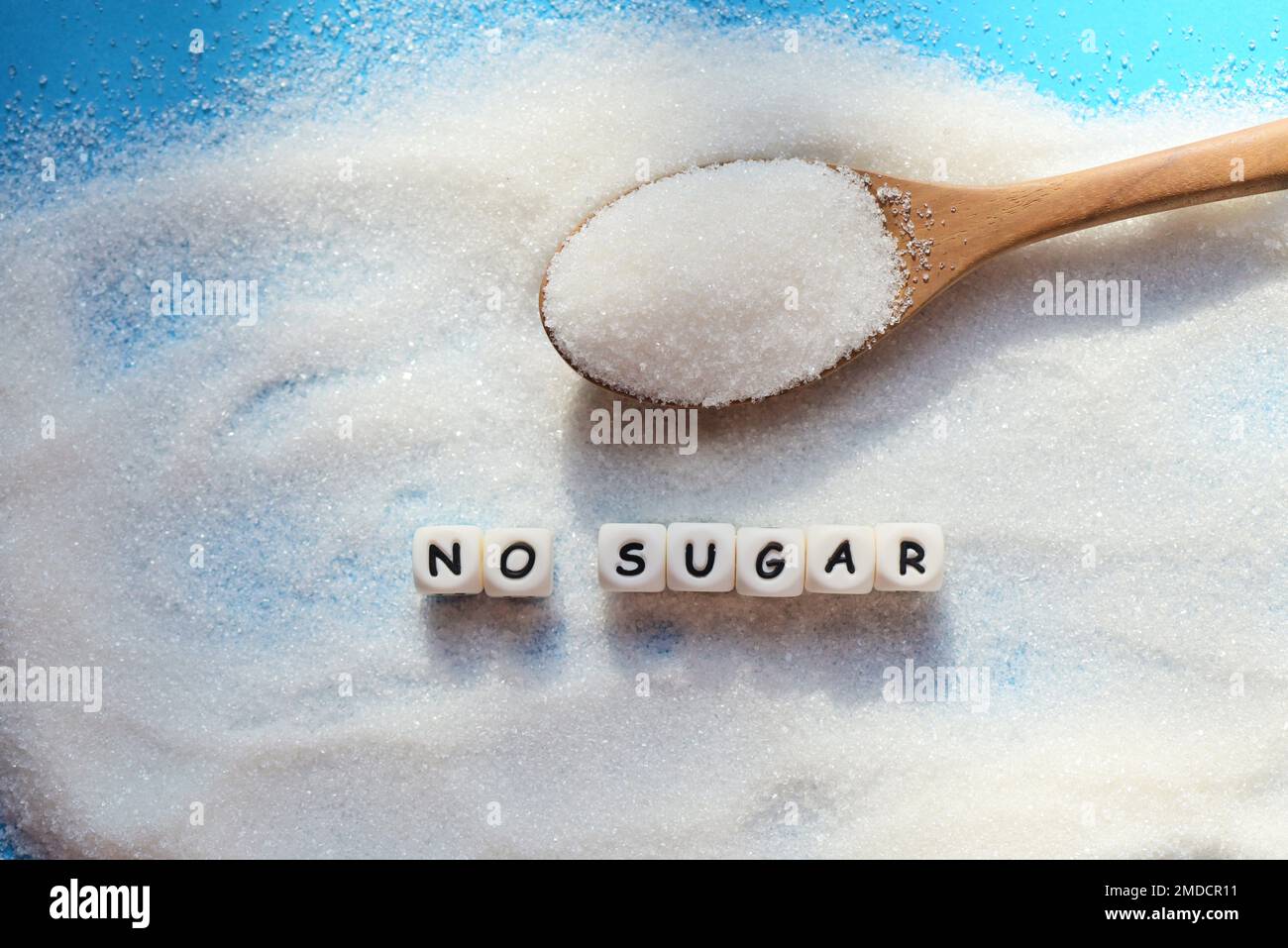 No sugar concept, Sugar on spoon and blur background, white sugar for ...