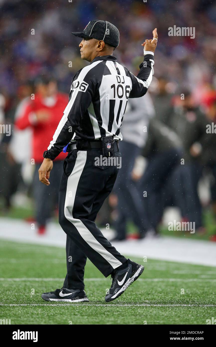 Down judge Patrick Holt (106) signals during the first half of an NFL ...