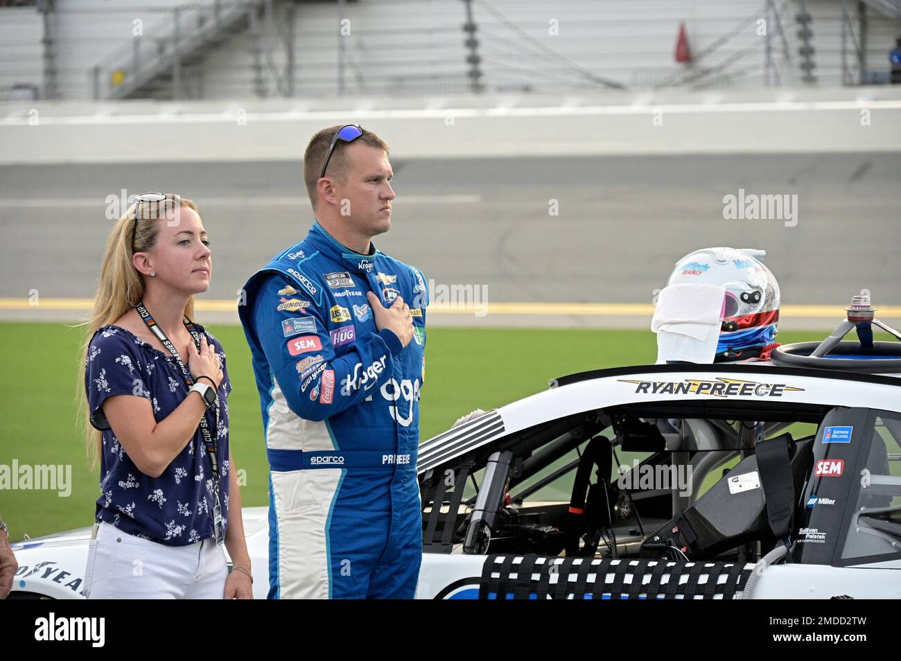 Driver Ryan Preece, right, stands next to his vehicle with his wife ...