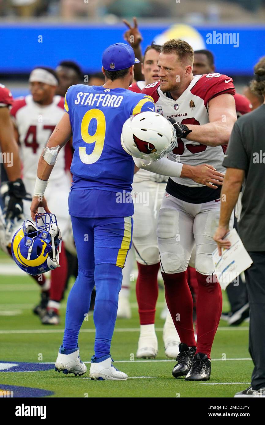 Arizona Cardinals defensive end J.J. Watt, right, hugs Los Angeles Rams ...