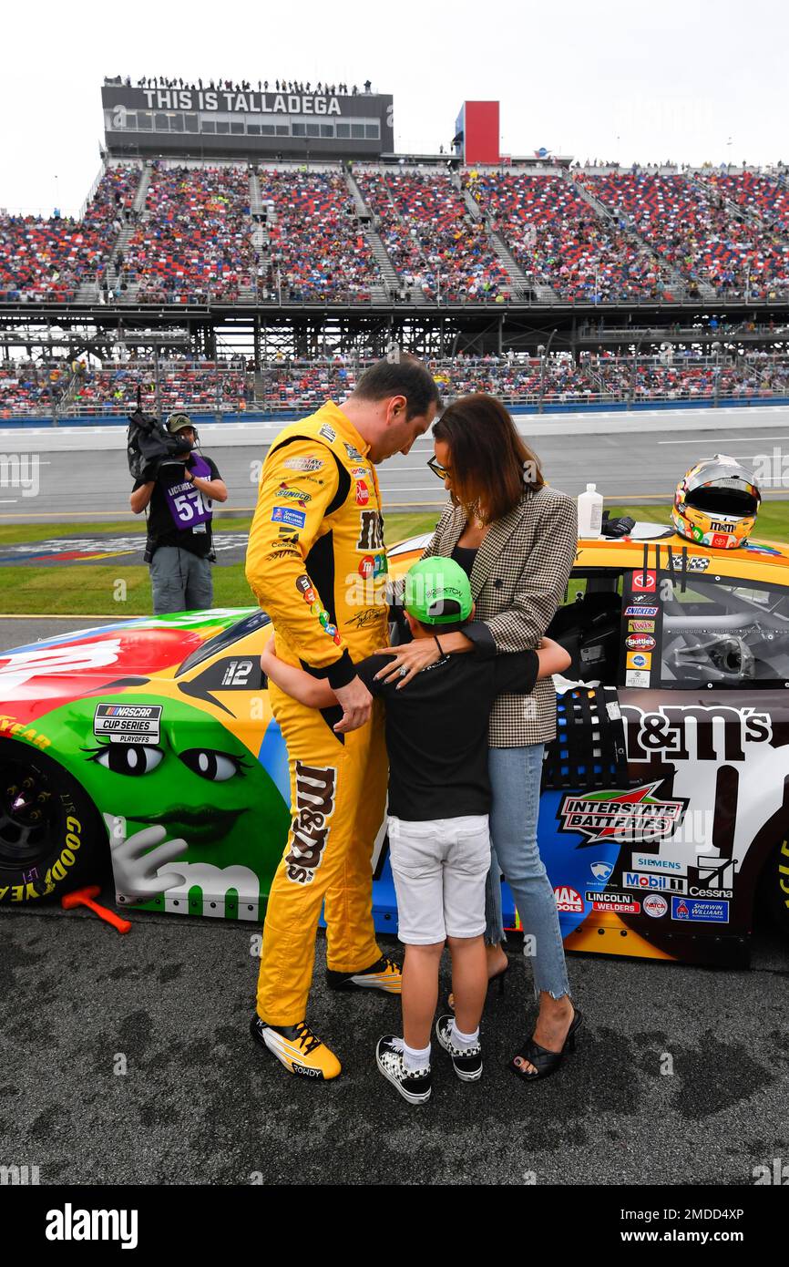 Kyle Busch, left, son Brexton, center, and wife Samantha put their arms ...