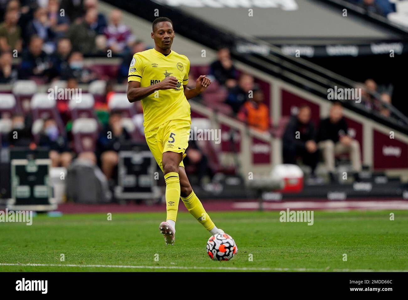 Brentford defender Ethan Pinnock (5) passes the ball during an English ...
