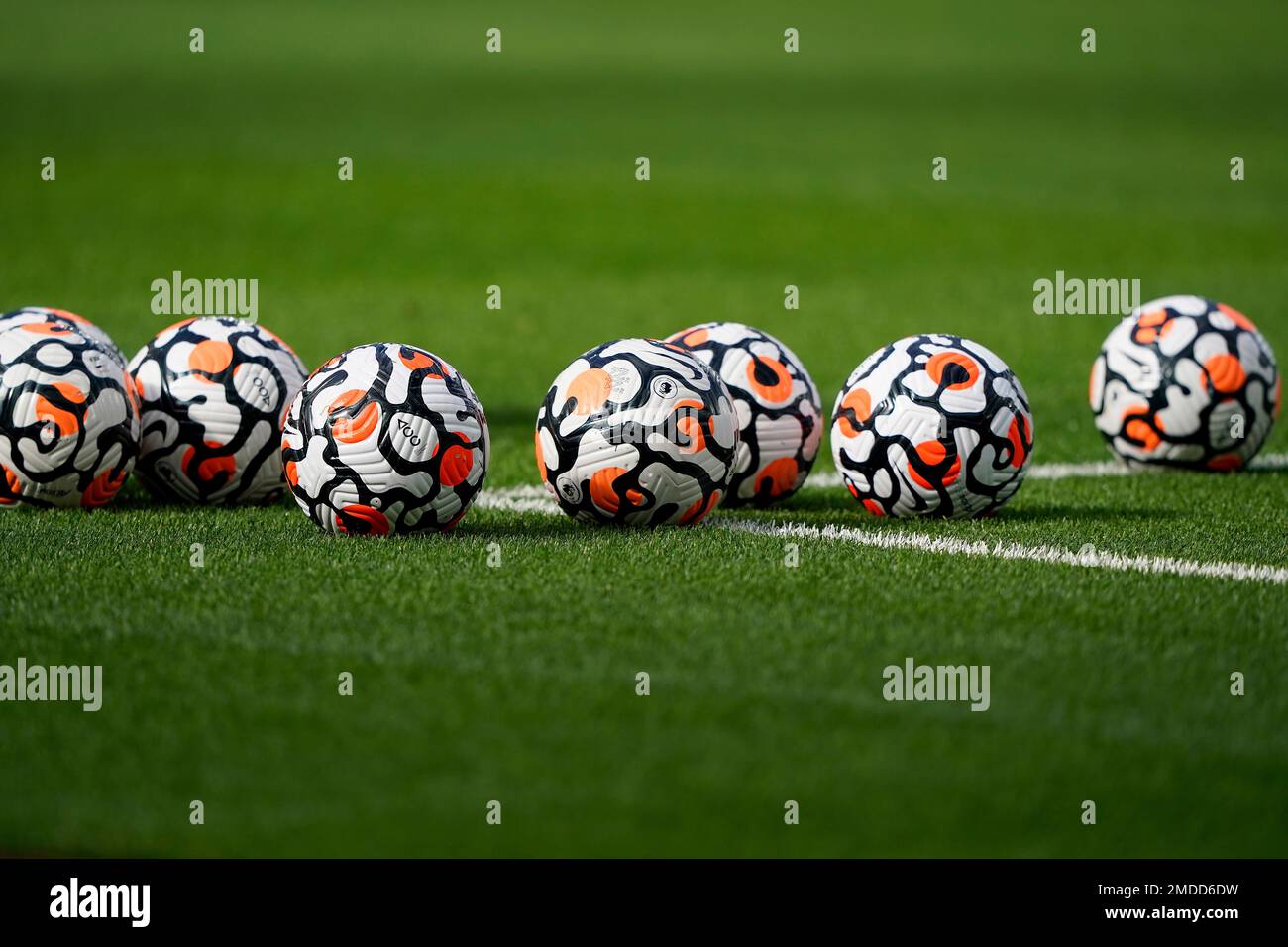 Balls sit on the pitch before an English Premier League soccer match ...