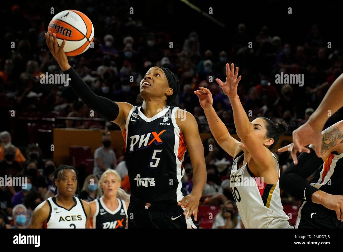 Phoenix Mercury guard Shey Peddy (5) drives past Las Vegas Aces guard ...