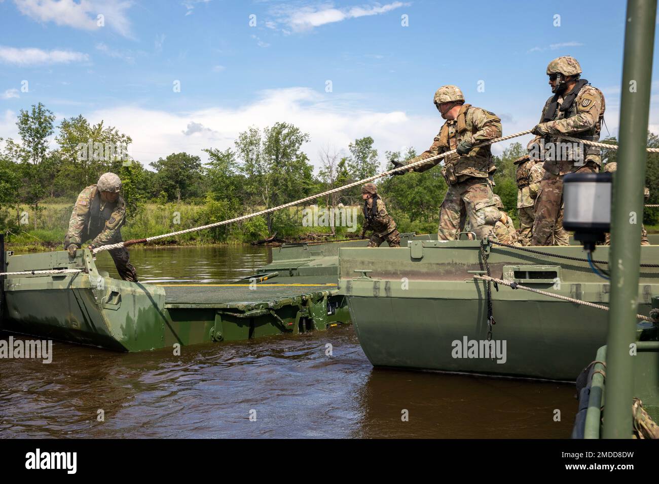 Bridge builder crewmembers with the Army Reserve 652nd Engineer Company ...