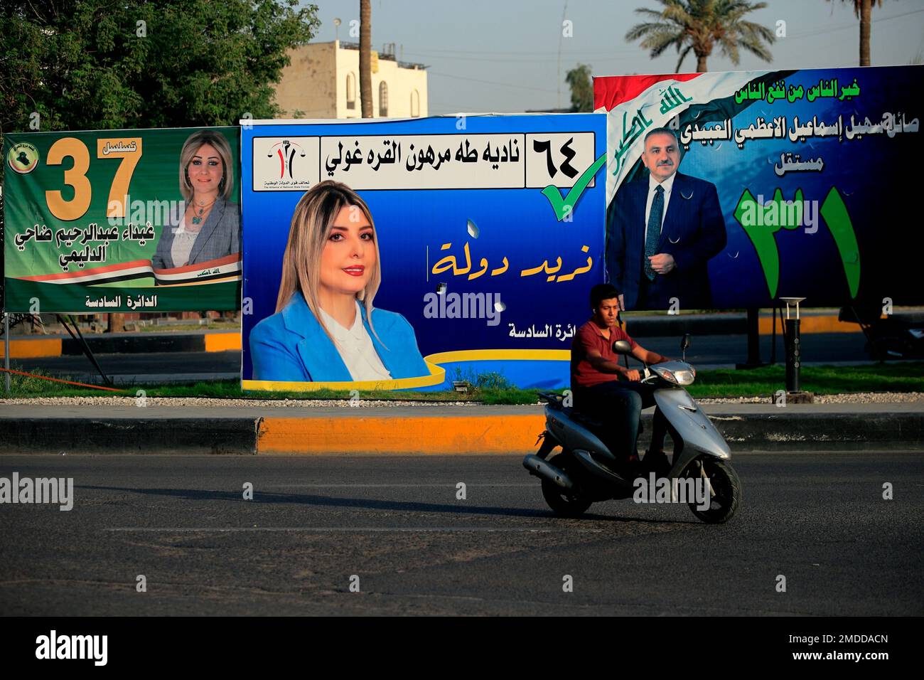Campaign posters for the upcoming parliamentary elections are displayed ...