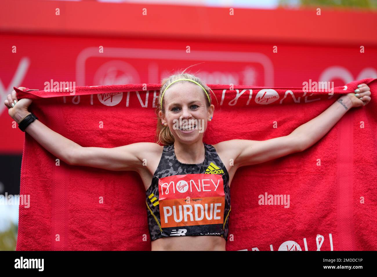 Britain's Charlotte Purdue celebrates being the first British runner to ...