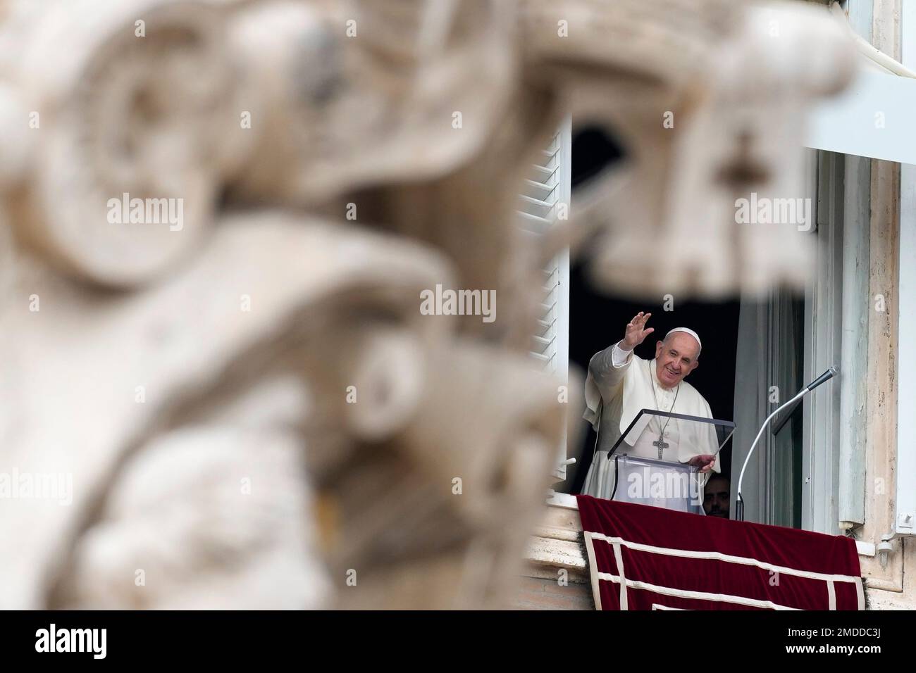 Pope Francis waves as he arrives for the Angelus noon prayer from the ...