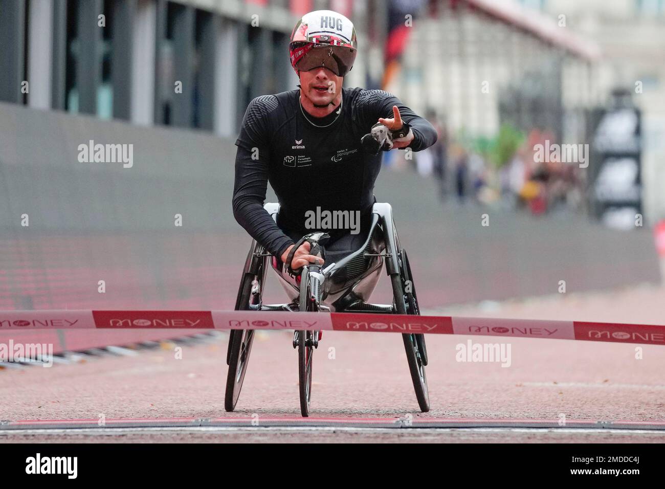 Switzerland's Marcel Hug crosses the finish line to win the Men's ...