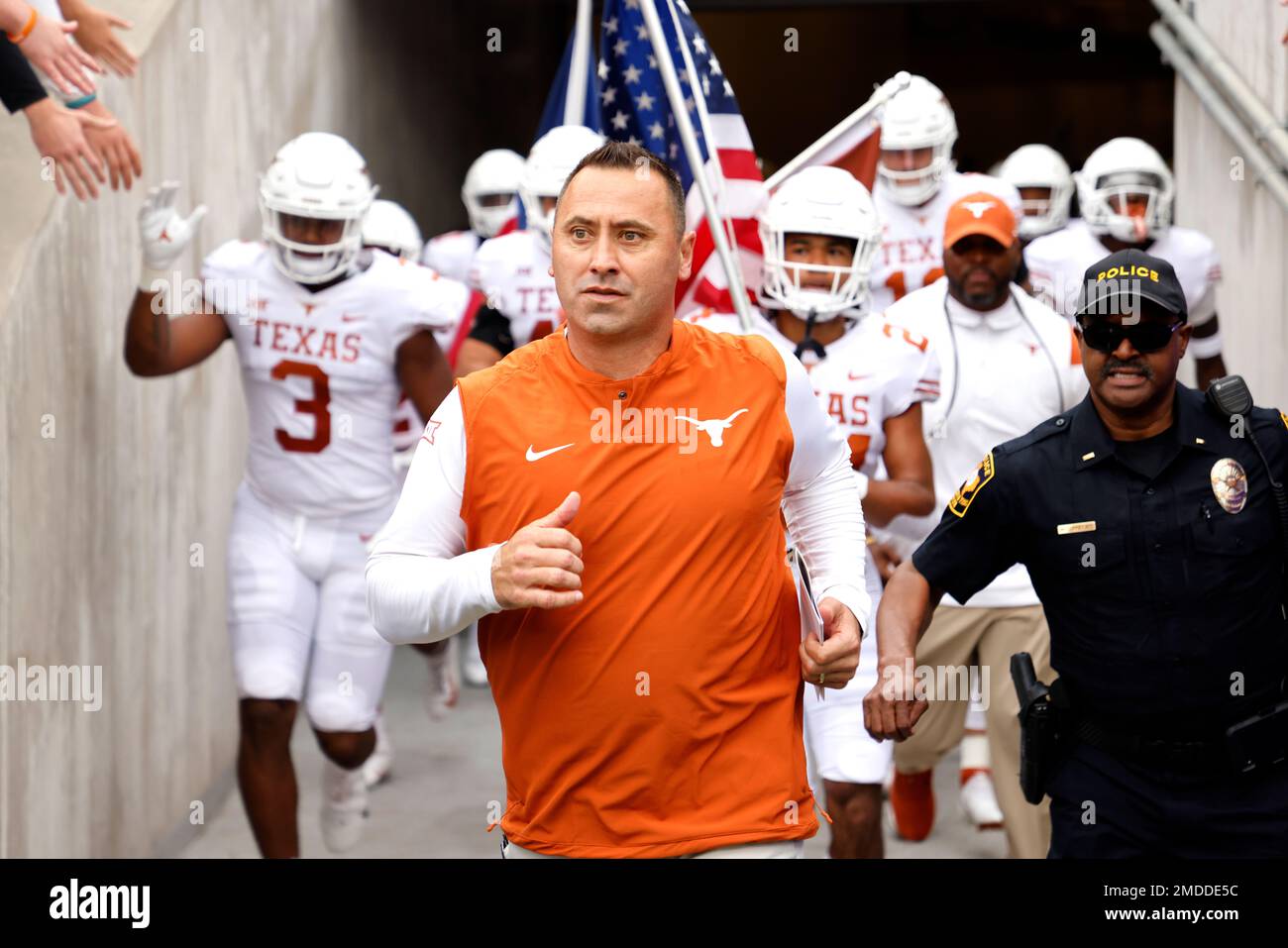 Texas head coach Steve Sarkisian leads his team to the field before ...