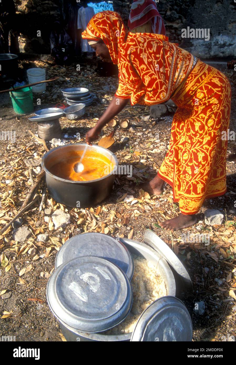 Muslim woman volunteer cooking for poor people outside a rural mosque ...