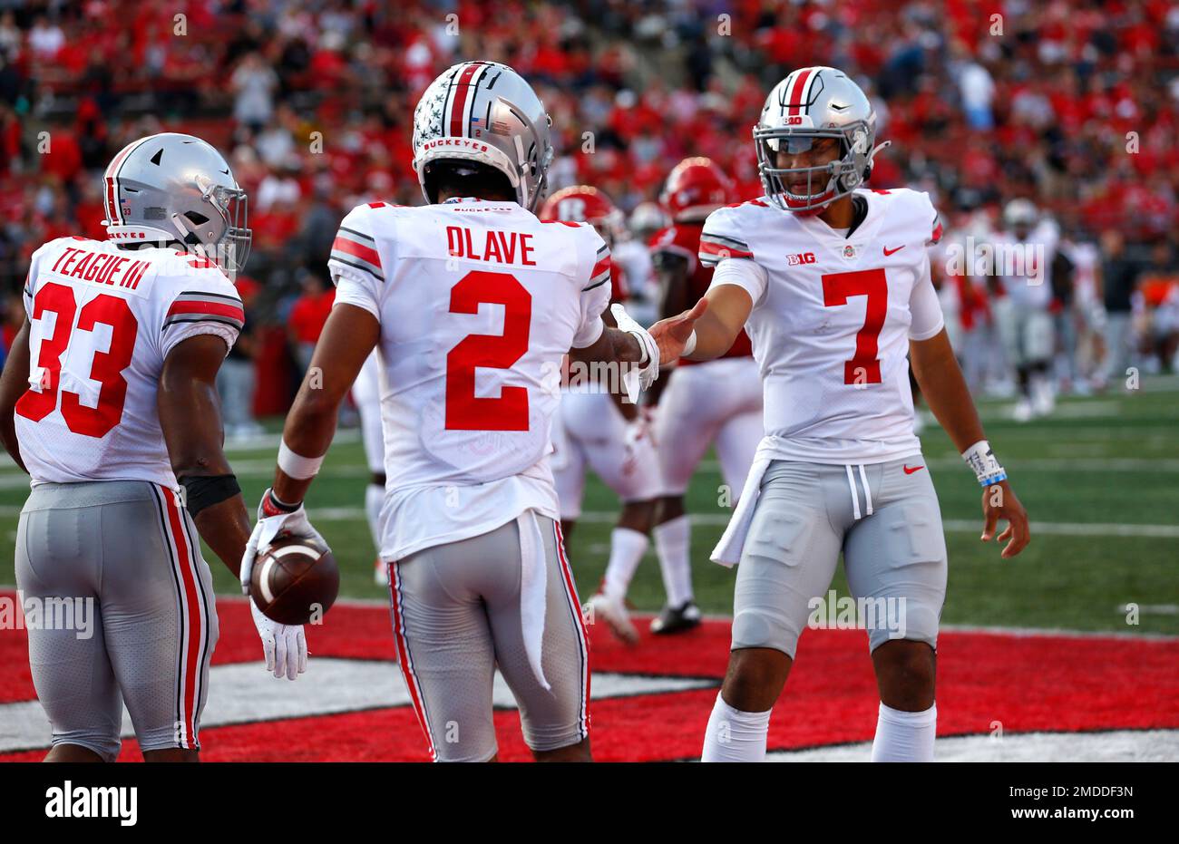Ohio State quarterback C.J. Stroud (7) shakes hands with wide receiver ...