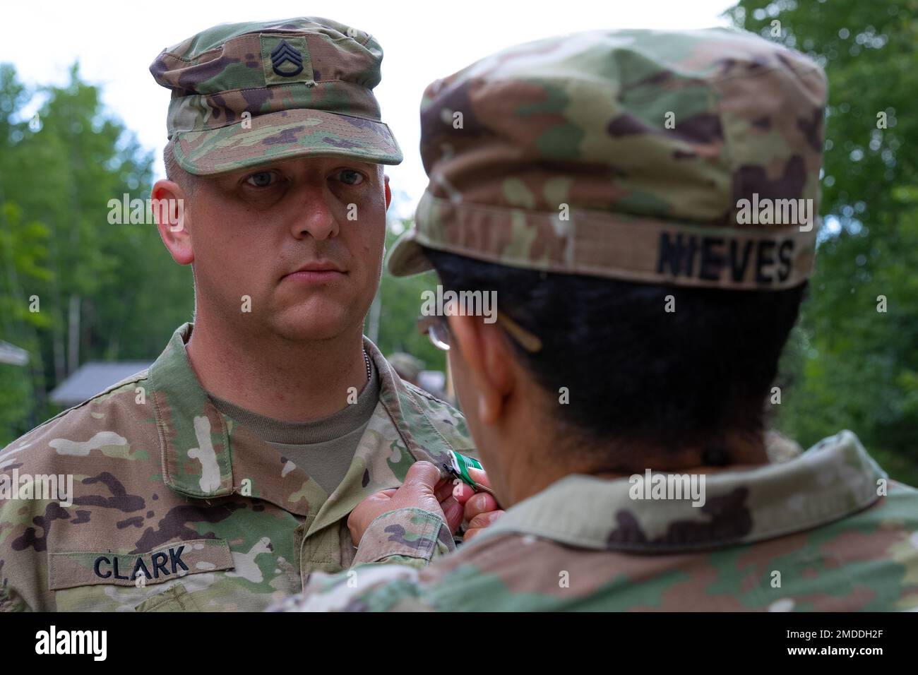 U.S. Army Staff Sgt. Douglas Clark, left, an infantryman assigned to the 1st Battalion, 102nd ...