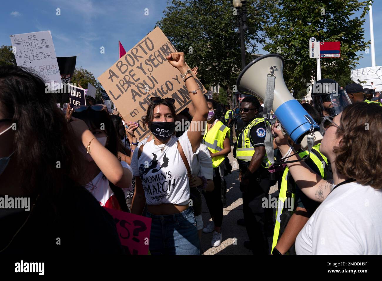 Demonstrators march outside of the the U.S. Supreme Court during the ...
