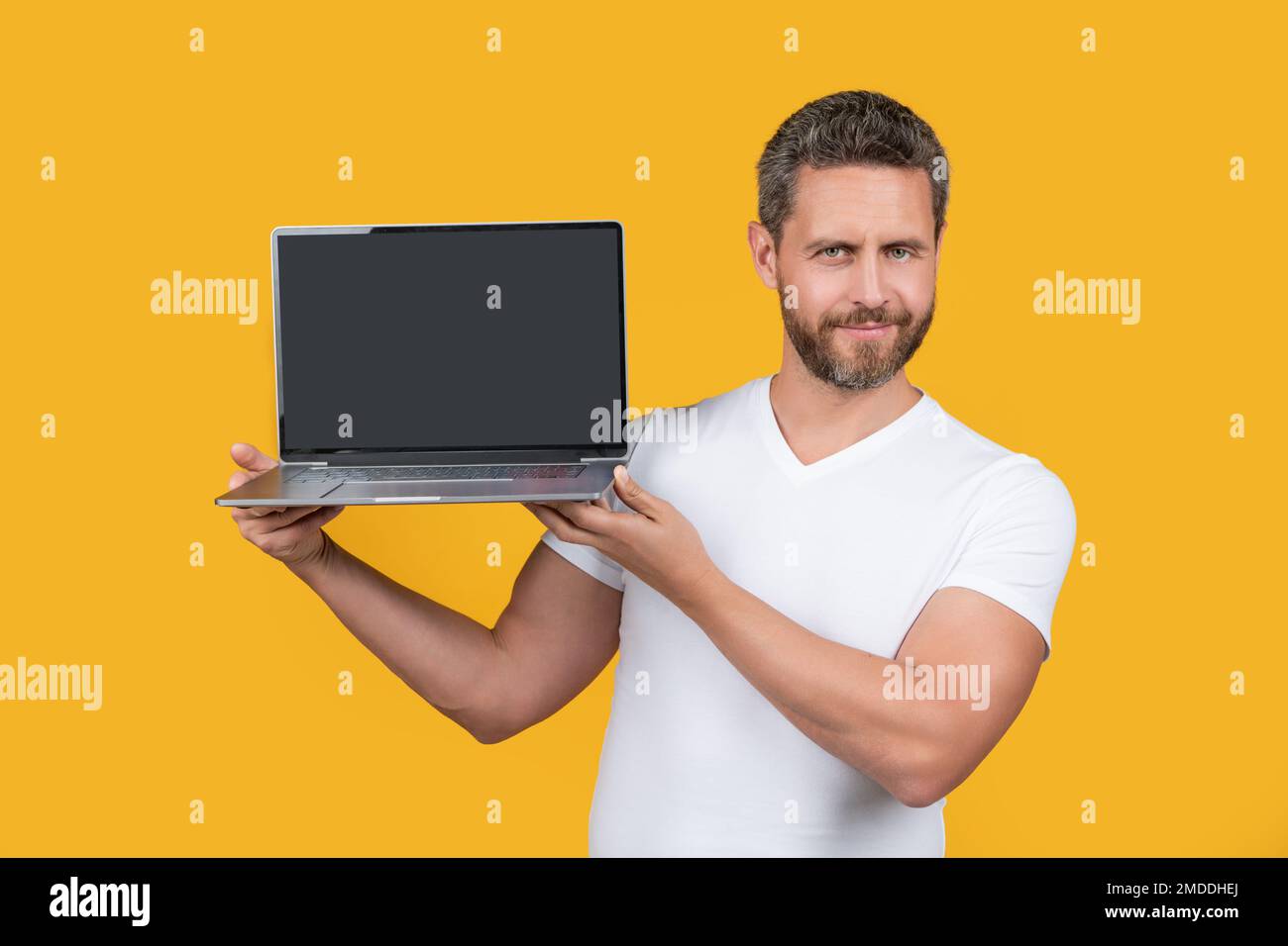 cheerful man showing app on screen with copy space. man showing app ...