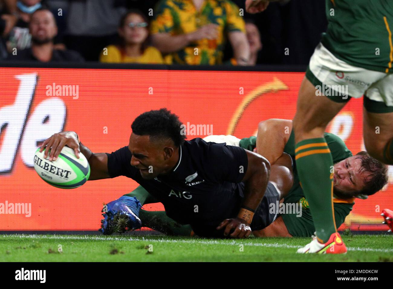 New Zealand's Sevu Reece, left, scores a try as South Africa's Duane ...