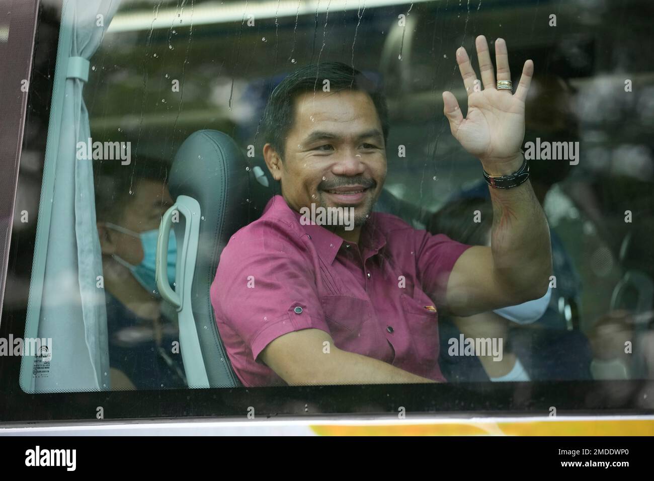 Retired Filipino boxing hero and senator Manny Pacquiao waves from his ...