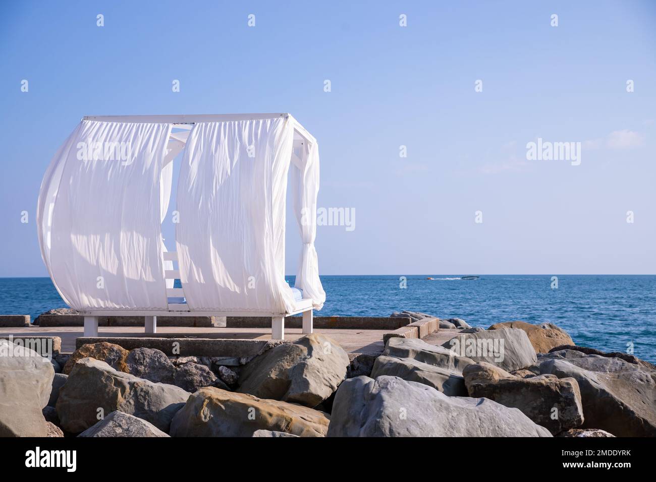 Scenic view empty white beach wooden canopies cabanas with white ...