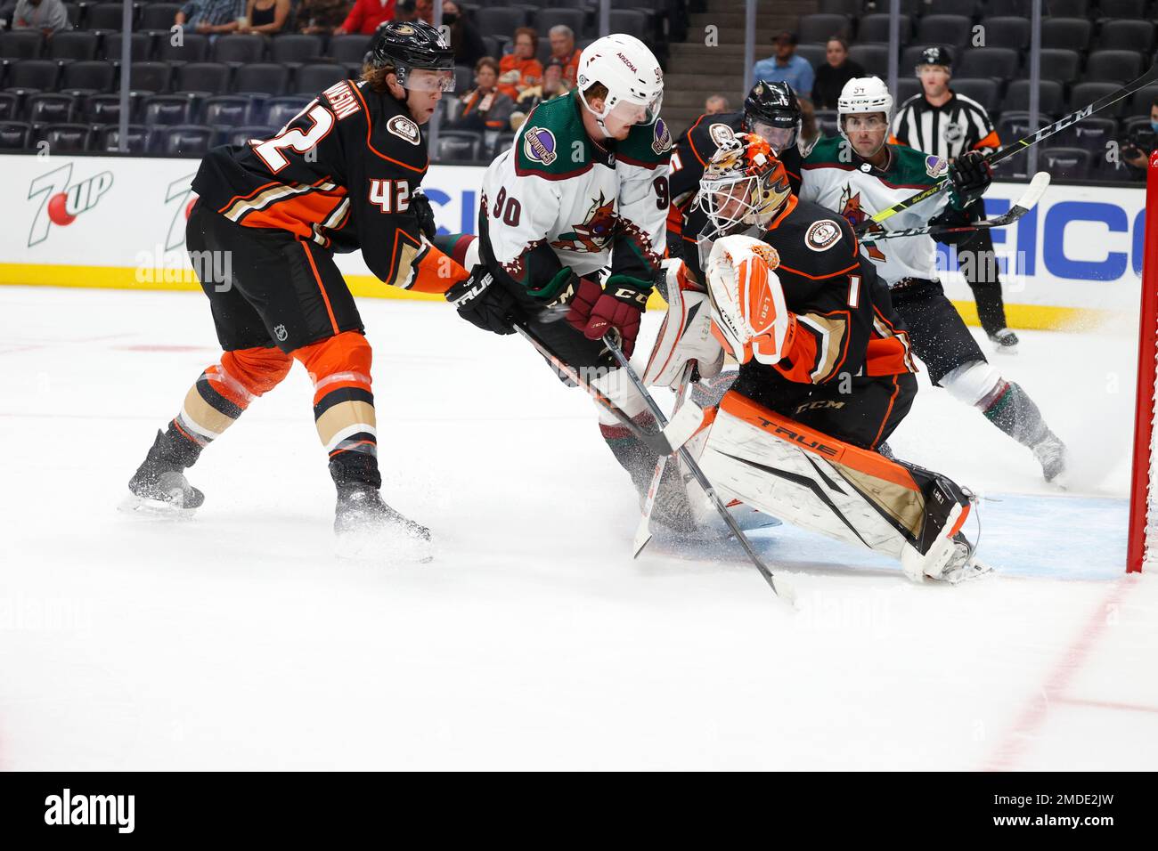 Arizona Coyotes forward Ben McCartney (90) collides with Anaheim Ducks ...