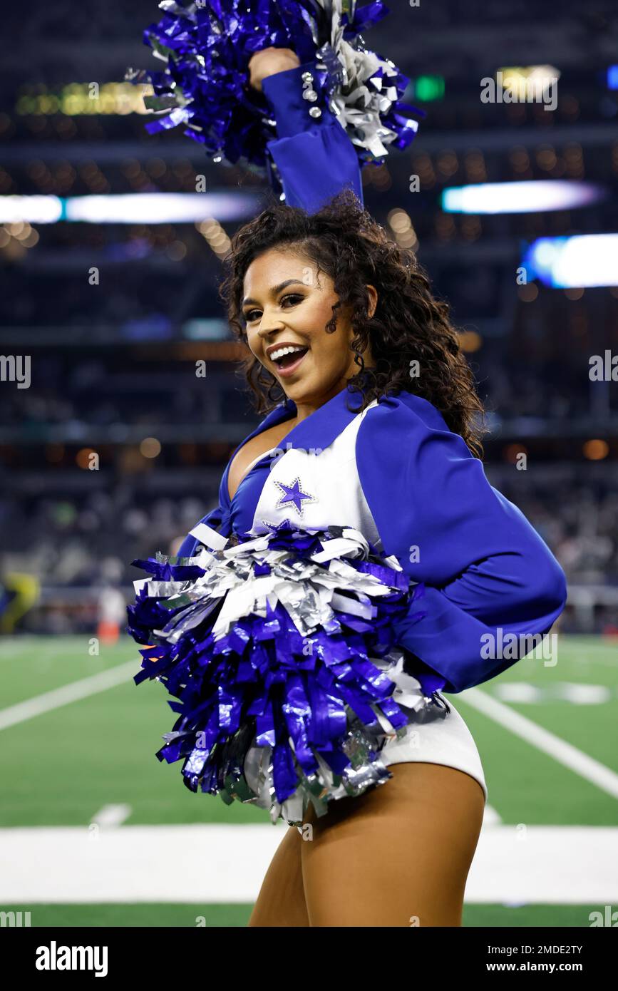 A Dallas Cowboys cheerleader performs during an NFL football game ...