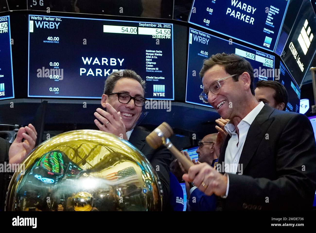 Warby Parker co-founder and co-CEO Neil Blumenthal, left, watches as ...