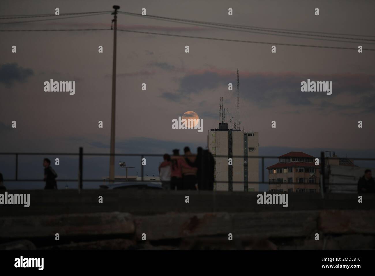 Palestinians enjoying the sunset on the beach of Gaza City. Palestine ...