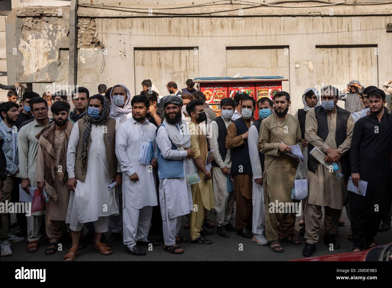 Afghans line up outside the Iranian Embassy to request travel visas in ...