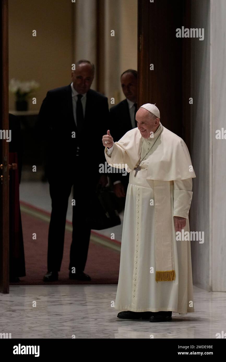 Pope Francis gives the thumb-up sign as he arrives for his weekly ...