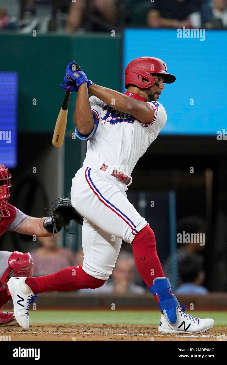 Texas Rangers' Leody Taveras follows through on a swing during a ...