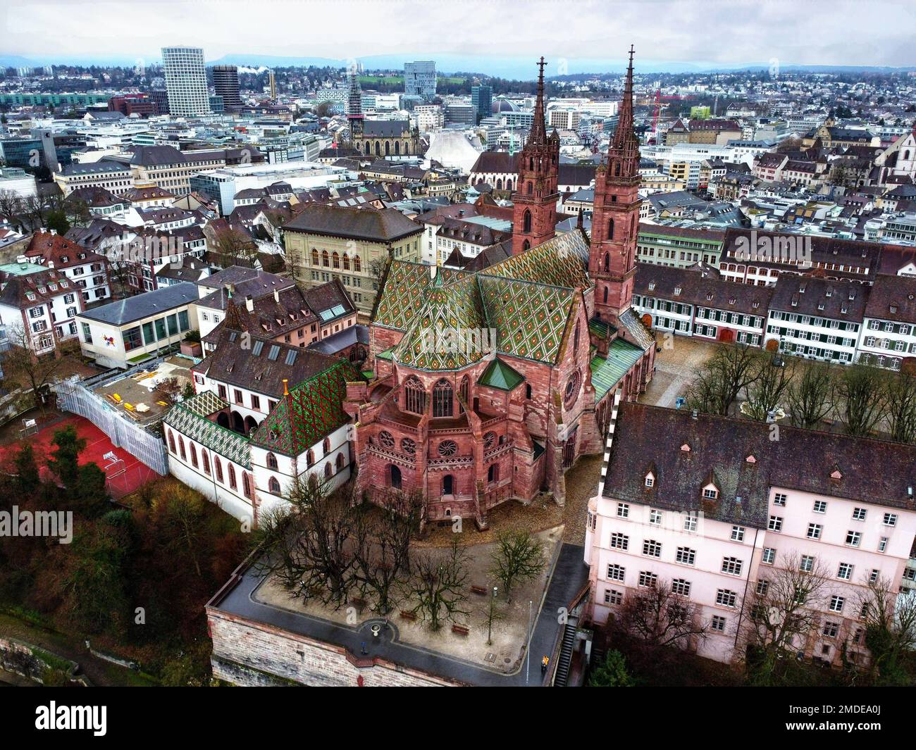 An aerial view of the Basel Cathedral with the city in the background ...