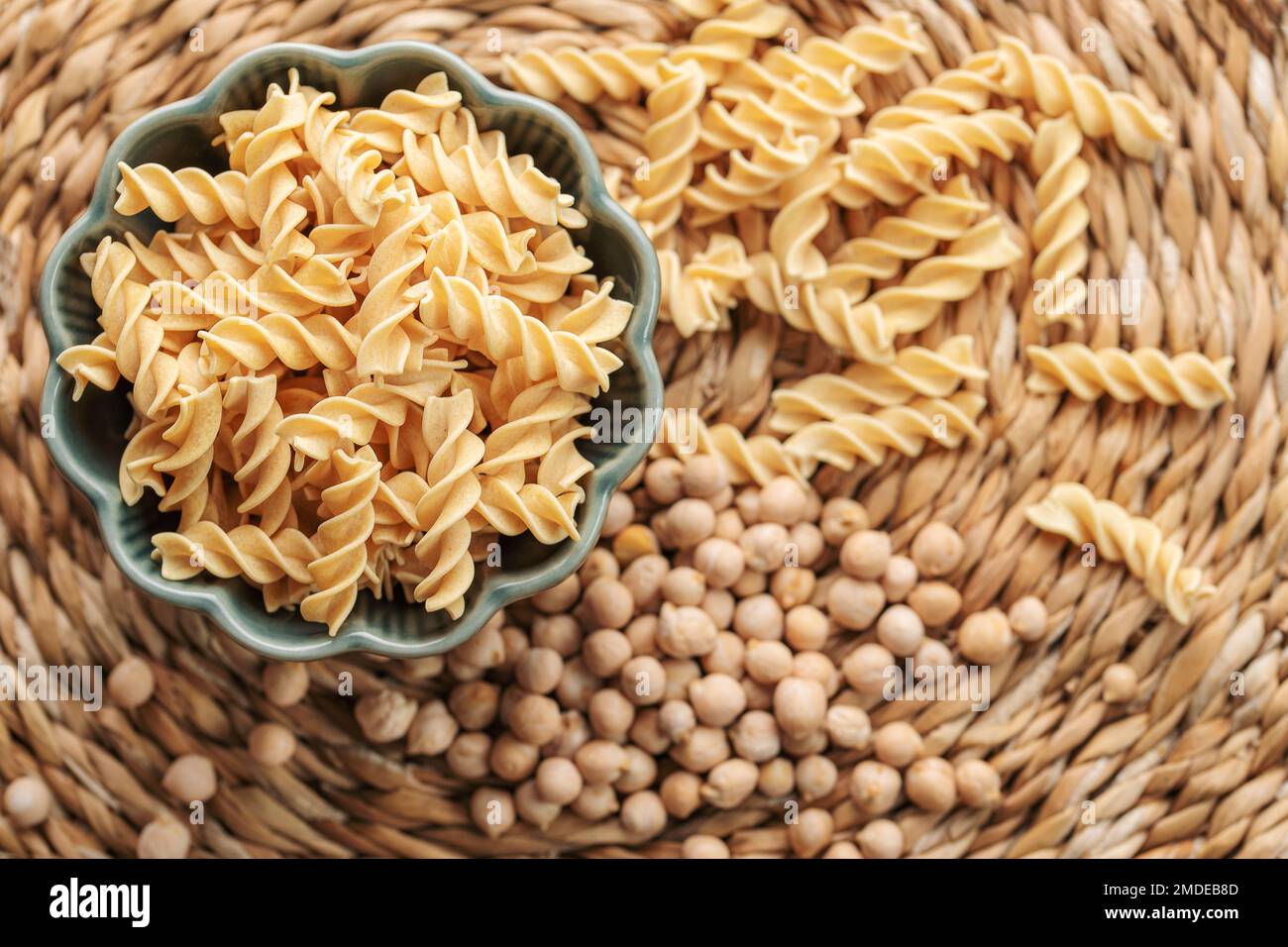 Chickpea bean fusilli pasta. Bowl with raw pasta and chickpea bean ...