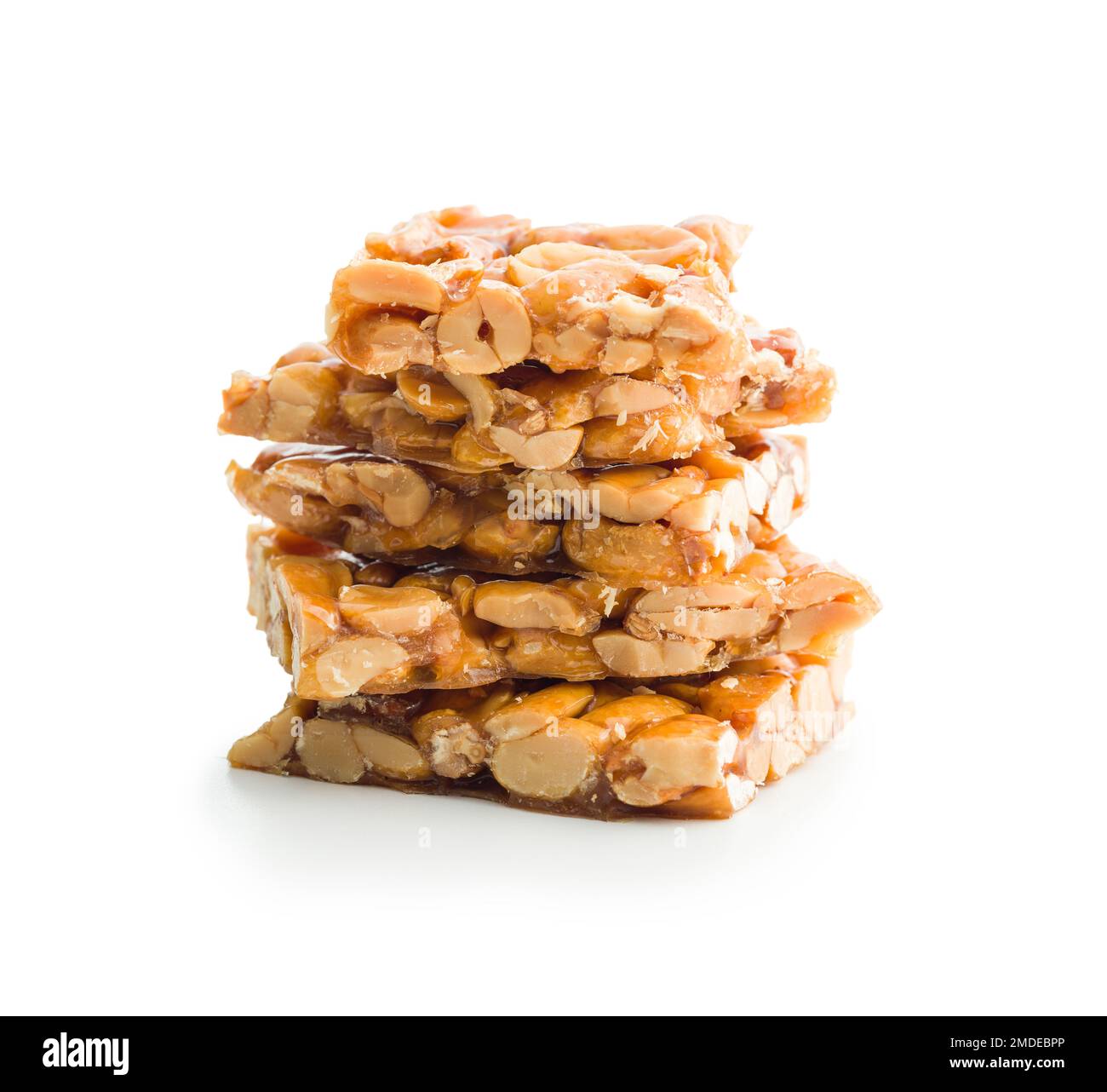 Sweet peanut brittle. Tasty peanuts in caramel isolated on the white ...