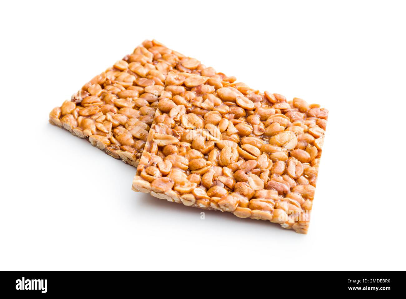 Sweet peanut brittle. Tasty peanuts in caramel isolated on the white ...