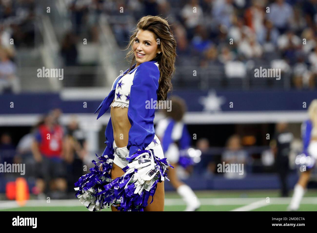 A member of the Dallas Cowboys Cheerleaders performs during the first ...