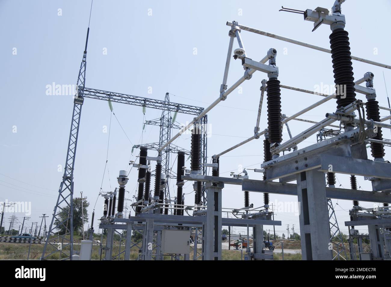 An aerial view of electrical substation surrounded by metal towers ...