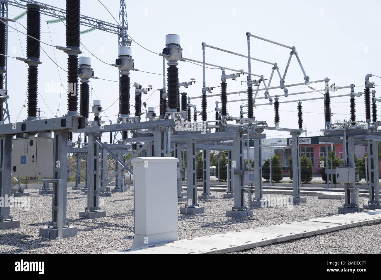 An aerial view of electrical substation surrounded by metal towers ...