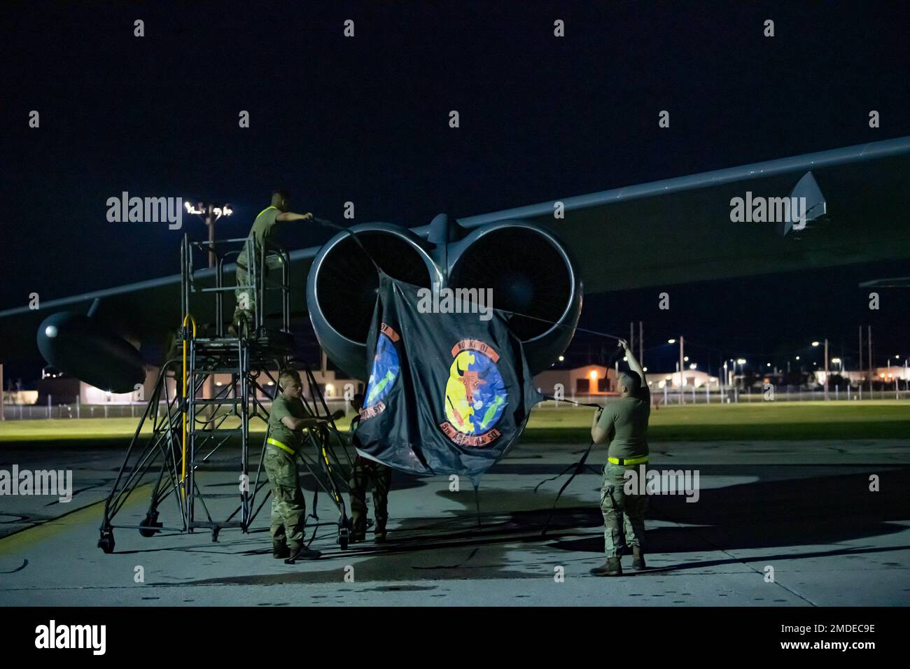 5th Aircraft Maintenance Squadron Airmen work quickly to prepare B-52Hs for inclement weather ...