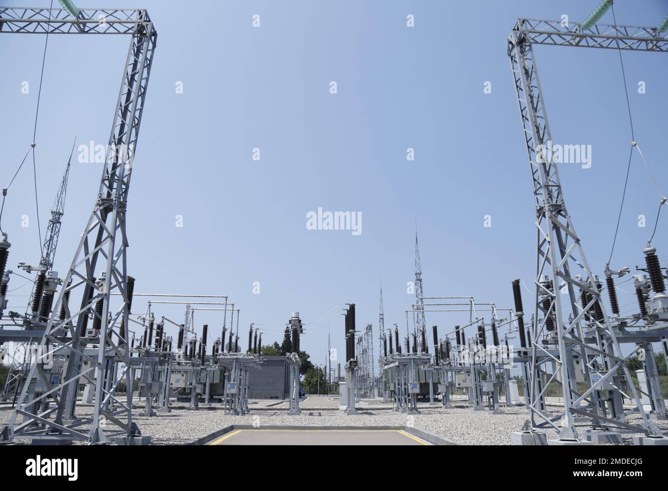 An aerial view of electrical substation surrounded by metal towers ...
