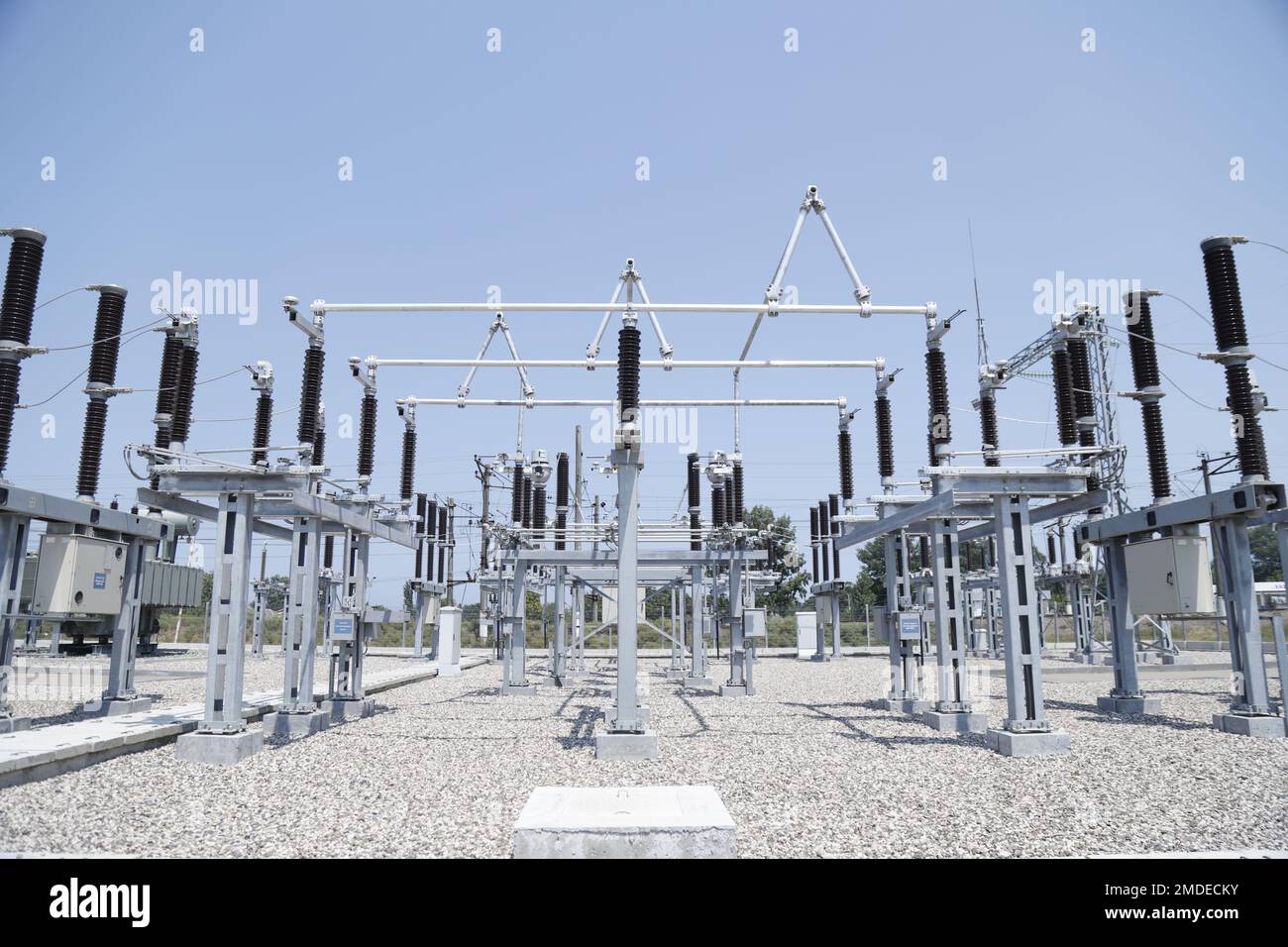 An aerial view of electrical substation surrounded by metal towers ...