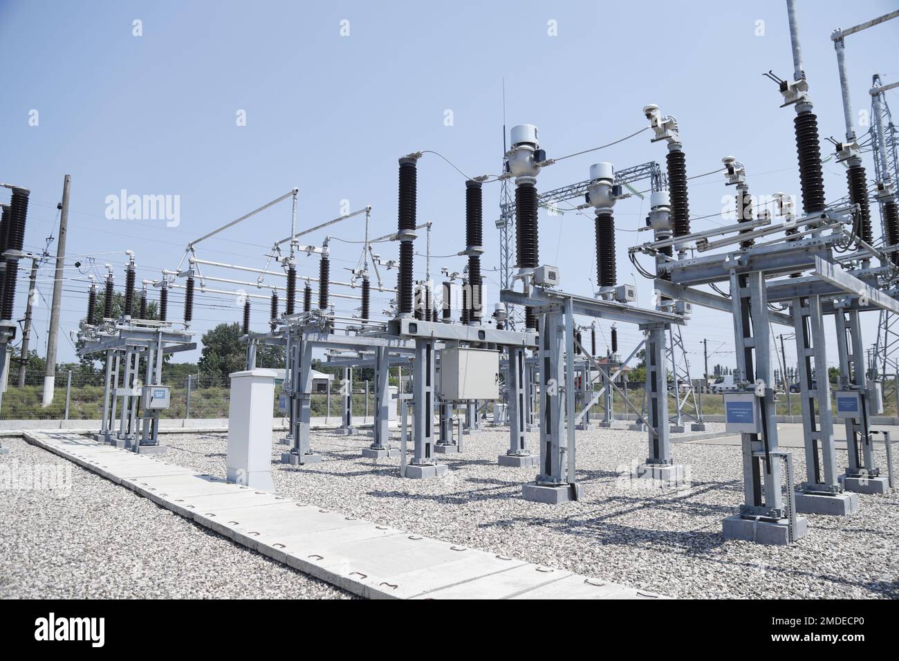 An aerial view of electrical substation surrounded by metal towers ...