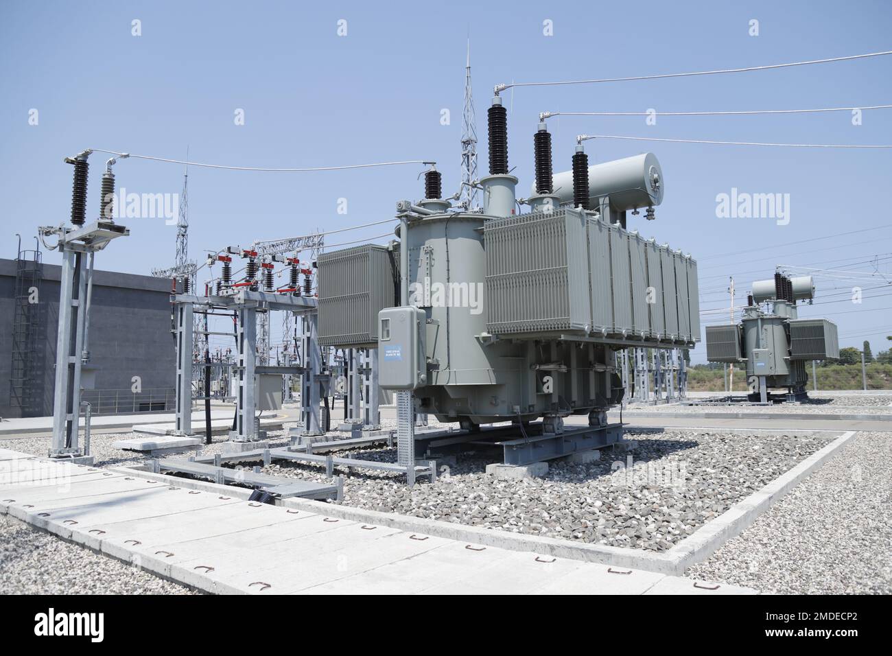 An aerial view of electrical substation surrounded by metal towers ...