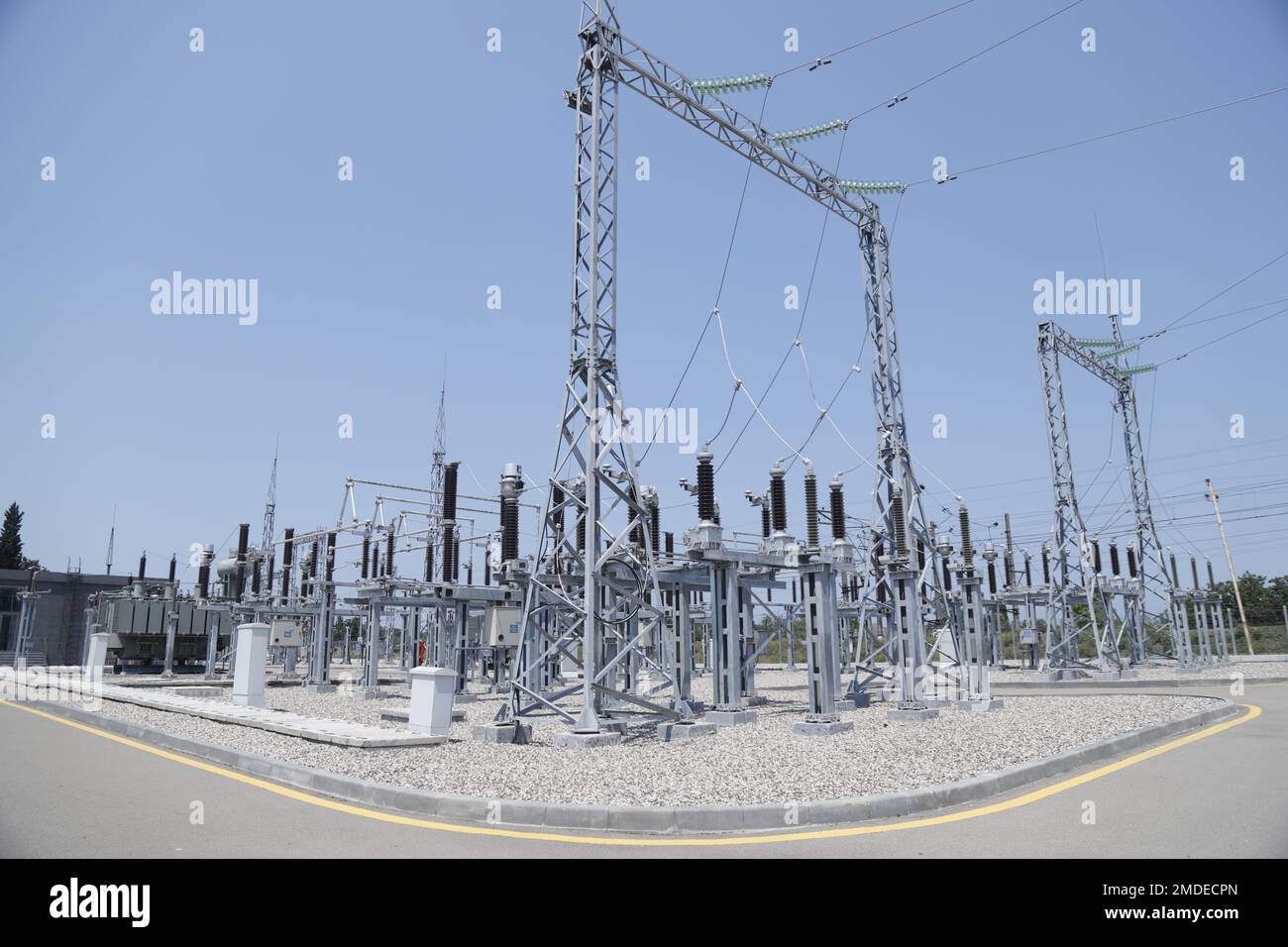 An aerial view of electrical substation surrounded by metal towers ...