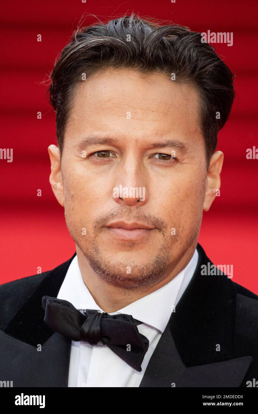 Director Cary Joji Fukunaga poses for photographers upon arrival for ...