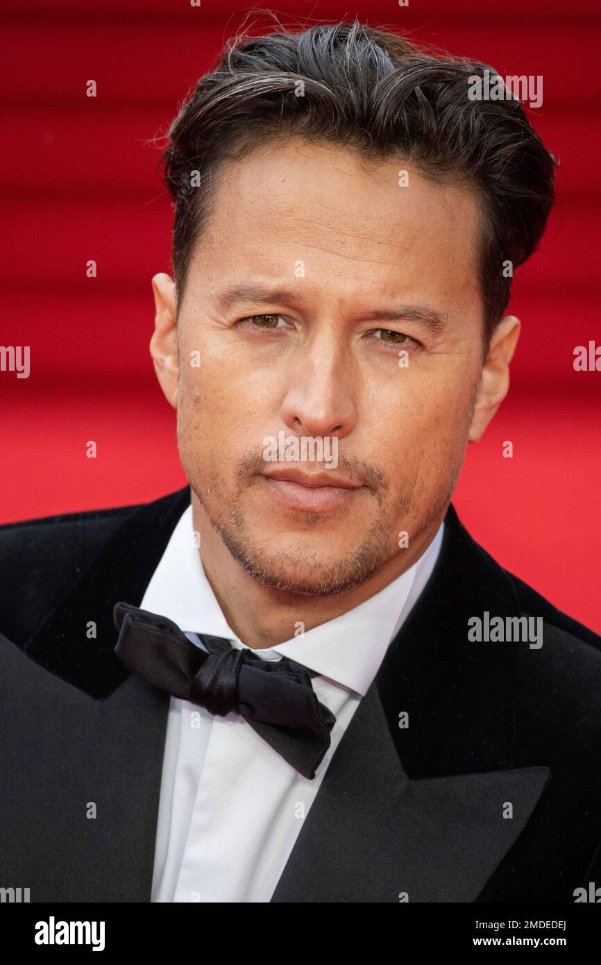 Director Cary Joji Fukunaga poses for photographers upon arrival for ...