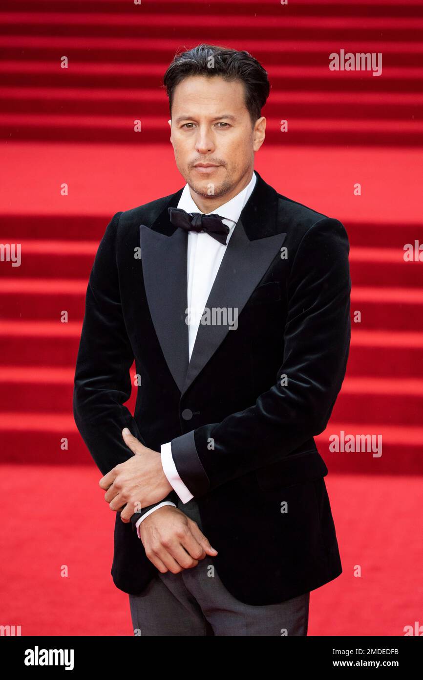 Director Cary Joji Fukunaga poses for photographers upon arrival for ...