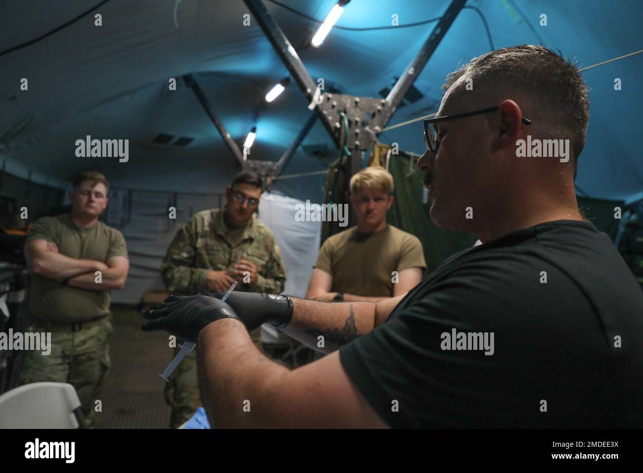 U.S. Army Capt. Gary Olund, a physicians assistant assigned to ...