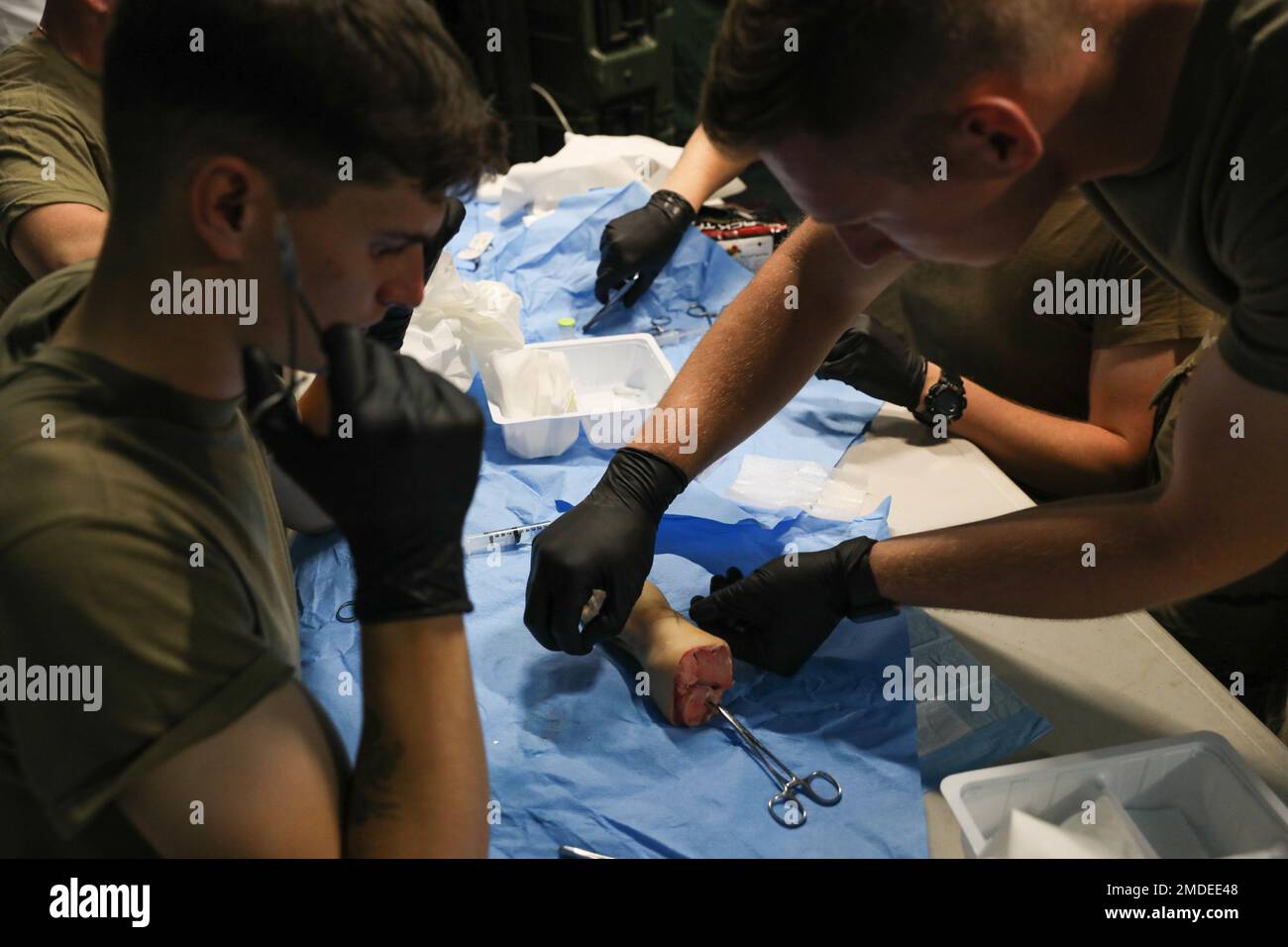 U.S. Army Sgt. Trevor Helmuth, a medic assigned to Headquarters and ...