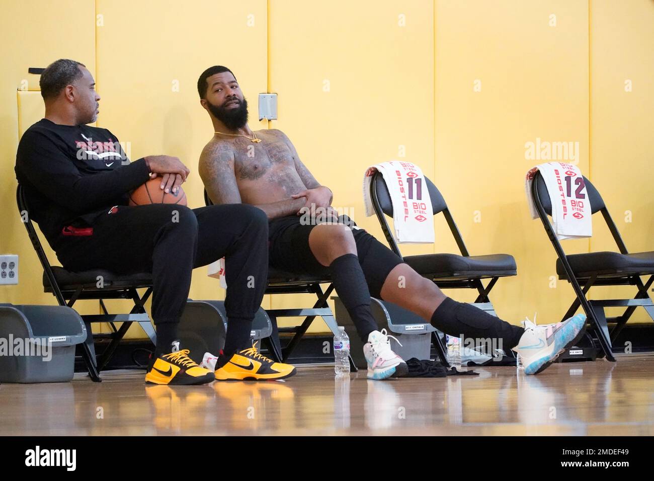 Miami Heat forward Markieff Morris, right, talks with assistant coach ...